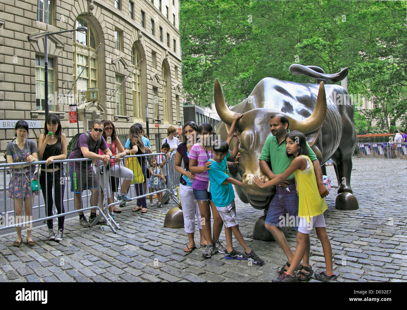 Tourists having picture taken with the Wal Street Bull lower Manhattan New York City Stock Photo ...