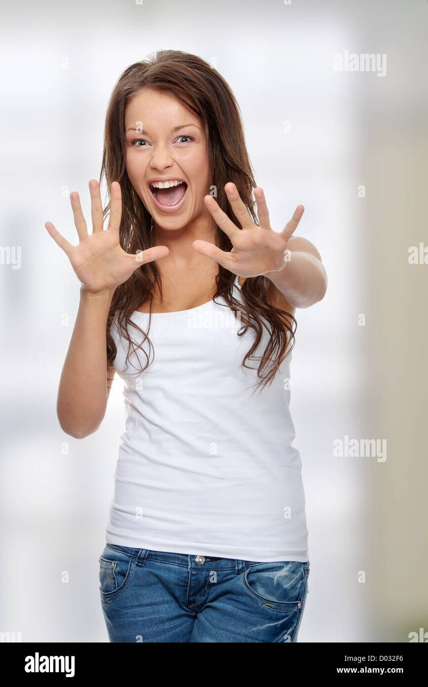 Young woman portrait - with face expression - scared Stock Photo - Alamy