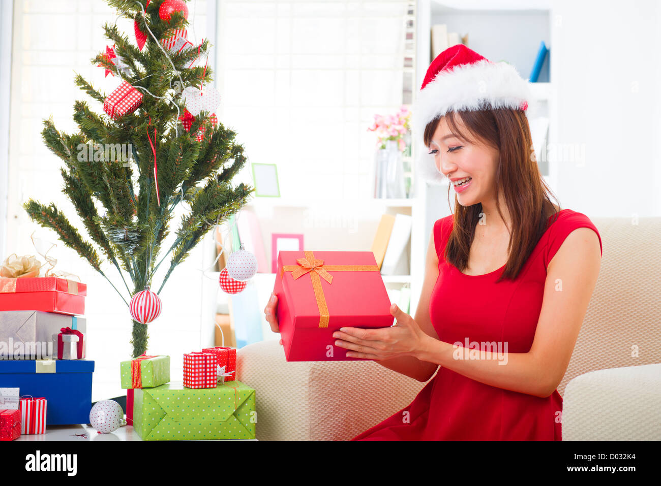 asian girl during christmas happily with her gifts Stock Photo - Alamy
