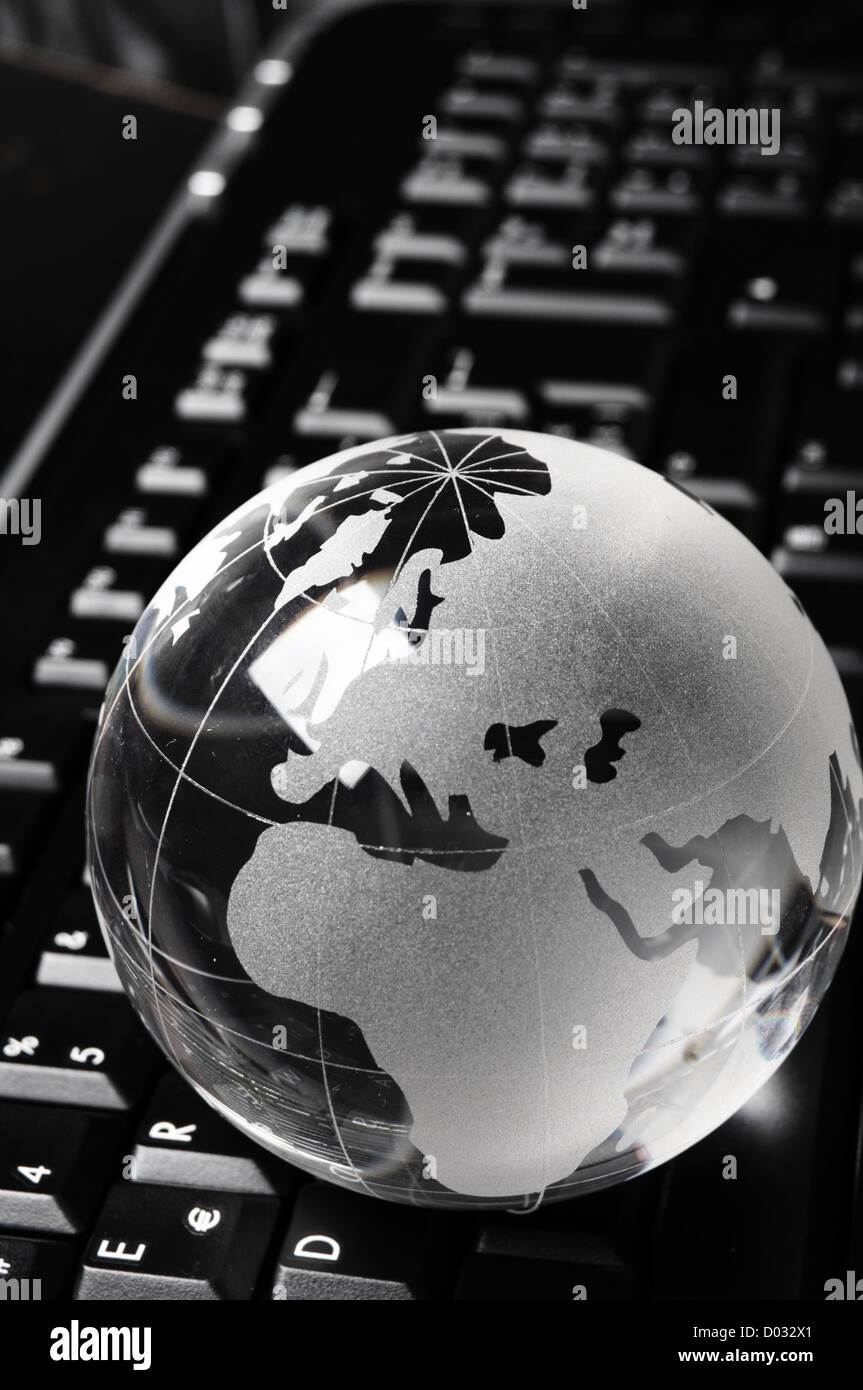 globe and keyboard showing global communication or internet concept ...