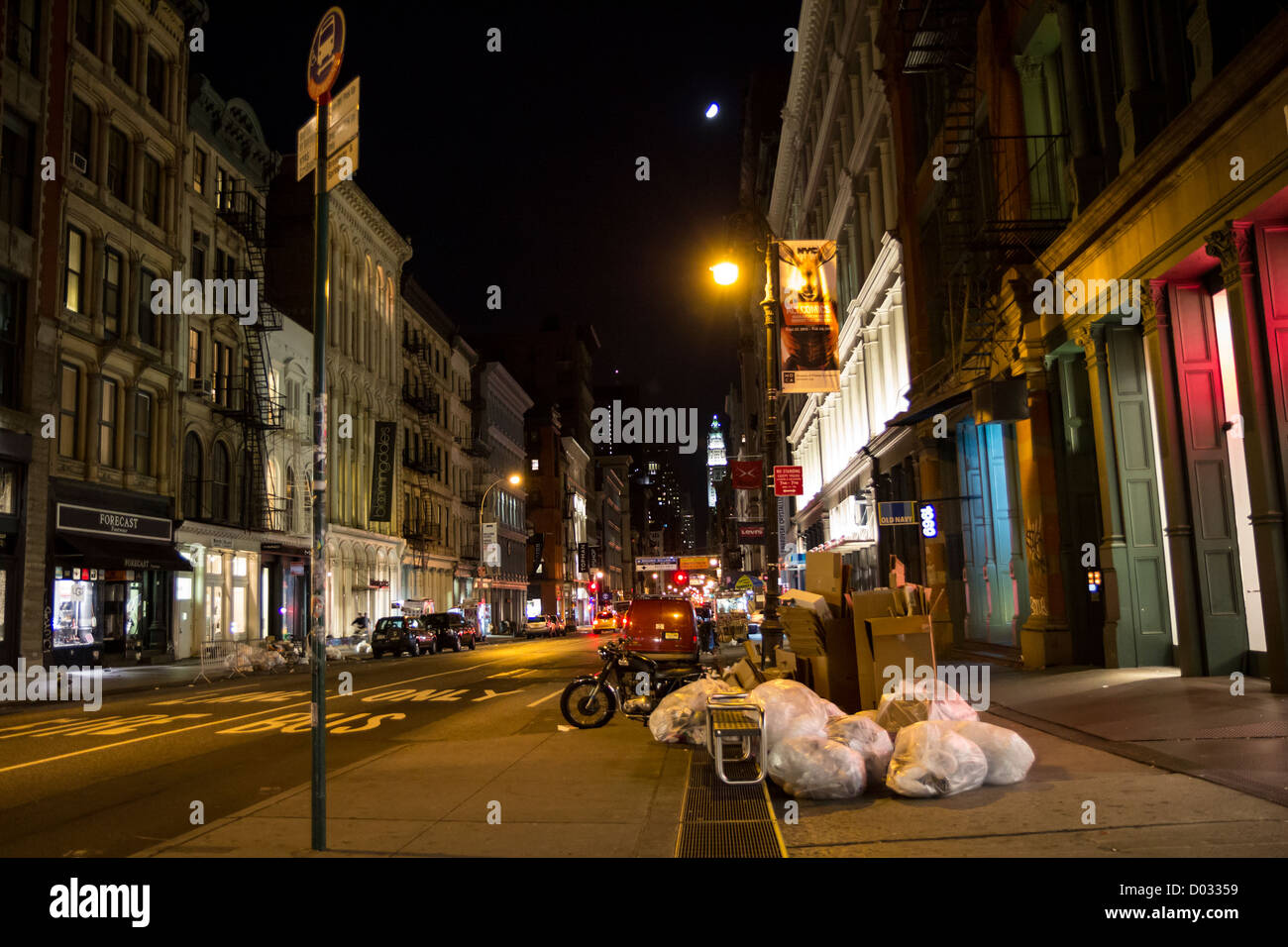 Trash in New York street at night Stock Photo - Alamy