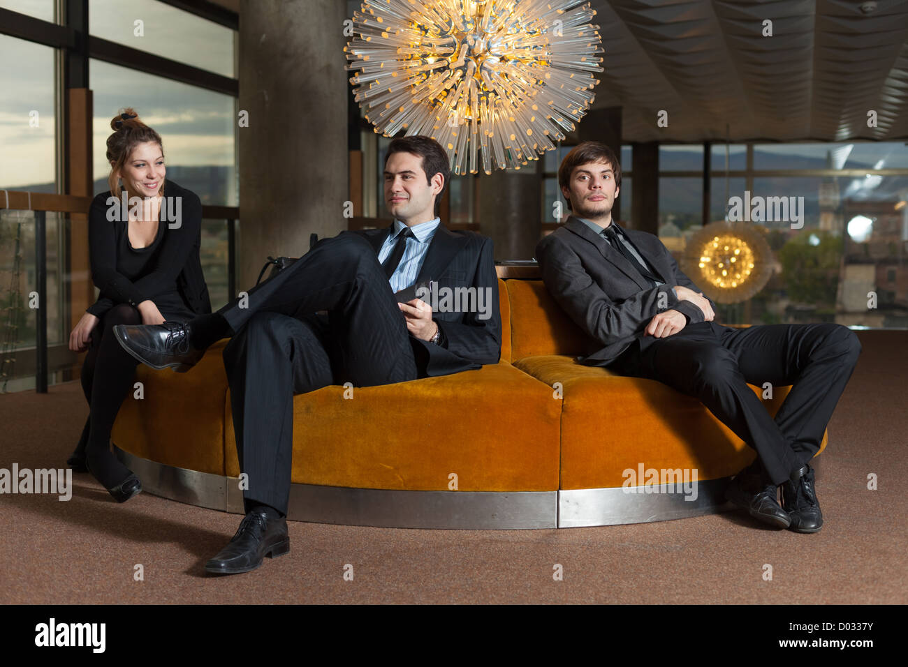 Young corporate executives sitting in luxurious interior Stock Photo ...