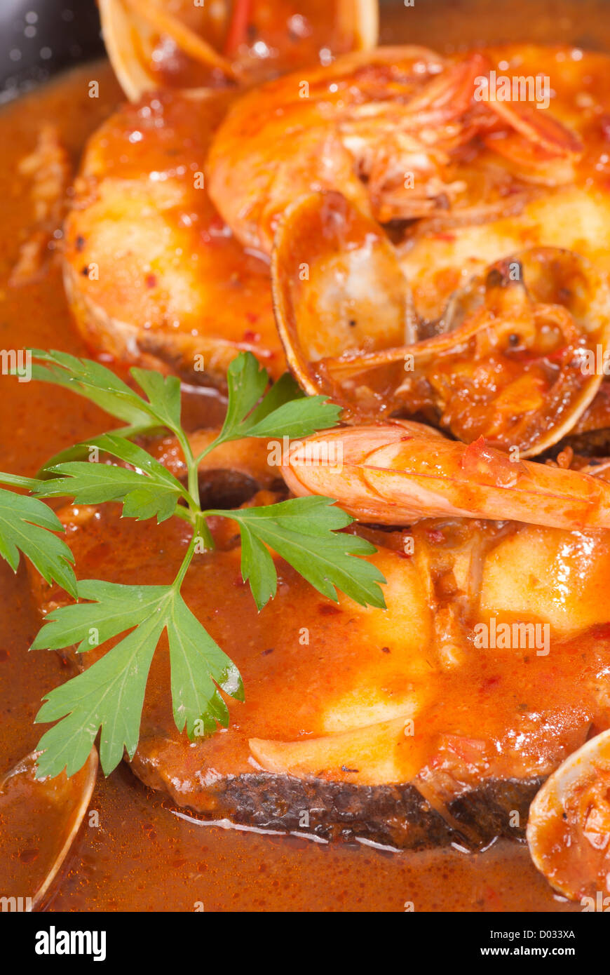 Seafood in cider sauce, merluza a la Sidra, a Spanish cuisine classic ...