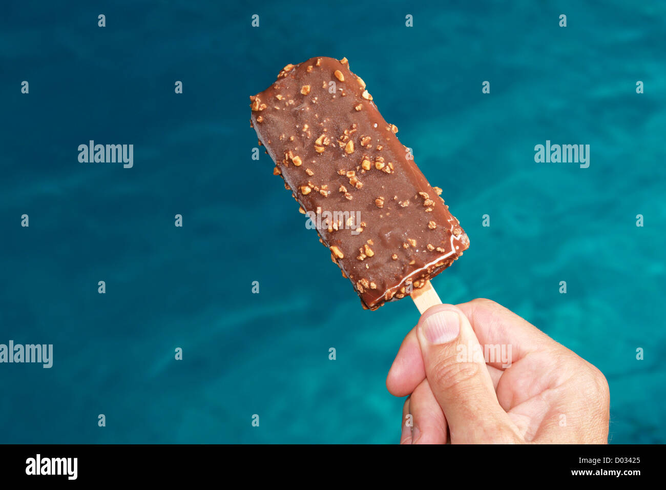 popsicle against a swimming pool on a hot day Stock Photo - Alamy