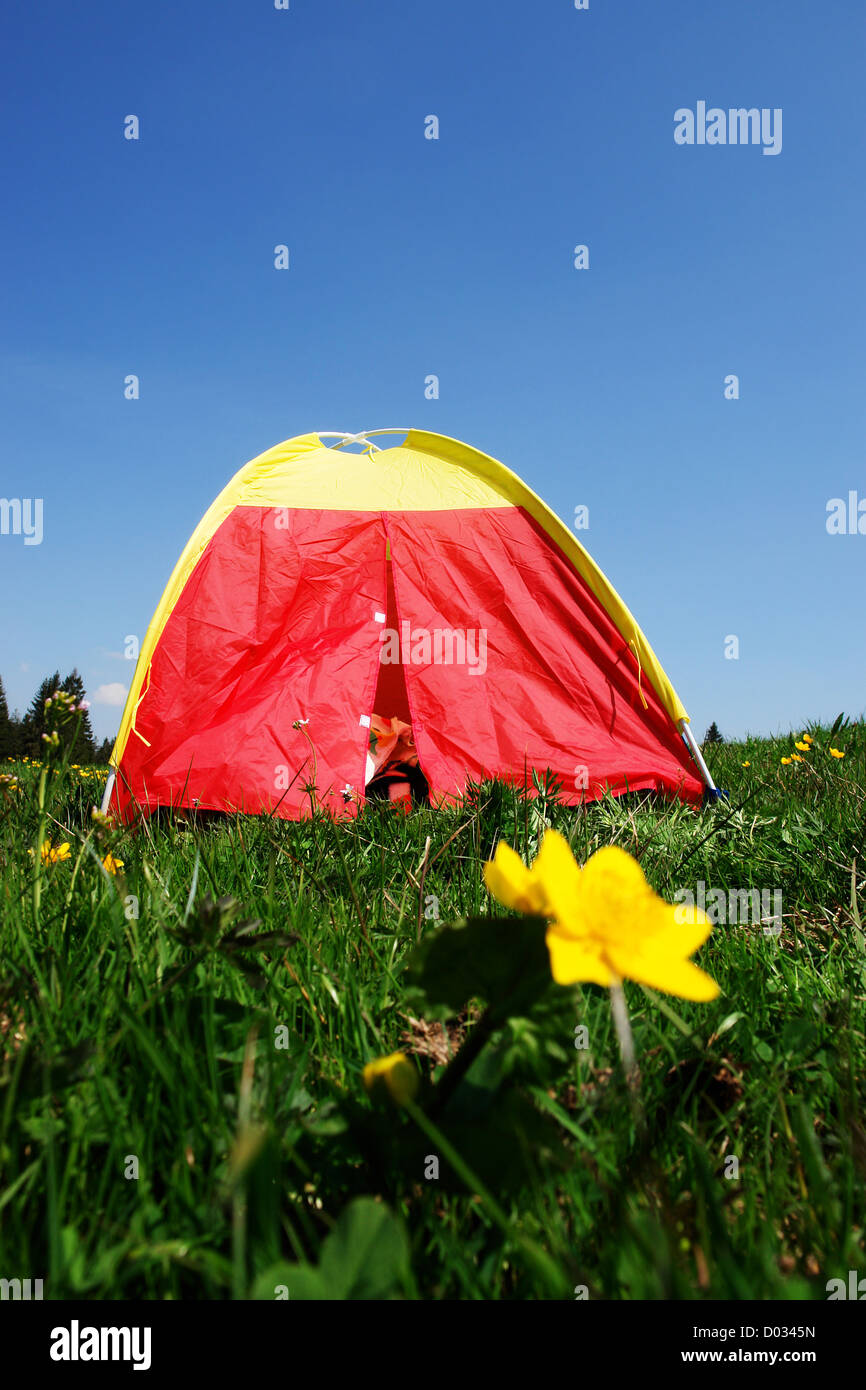 A colourful tent in the meadow outside Stock Photo - Alamy