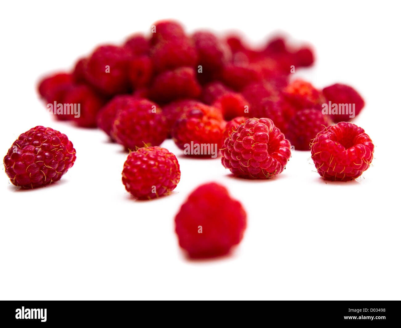 Raspberries fruits isolated over a white background Stock Photo - Alamy