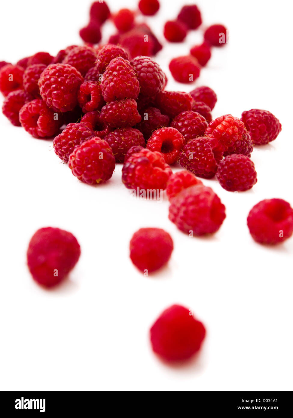 Raspberries fruits isolated over a white background Stock Photo - Alamy