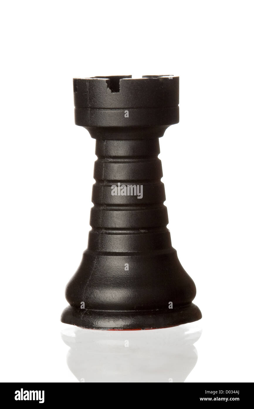 Black rook chess piece isolated on white background with reflection on ...