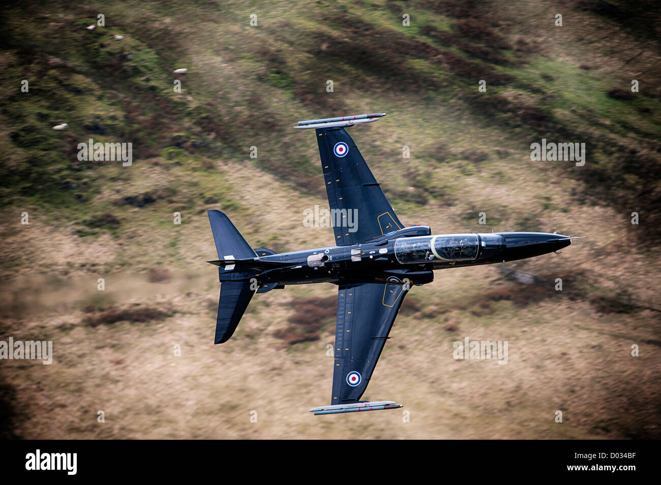 Hawk T2 low flying north wales mach loop shot from the side of a hill ...