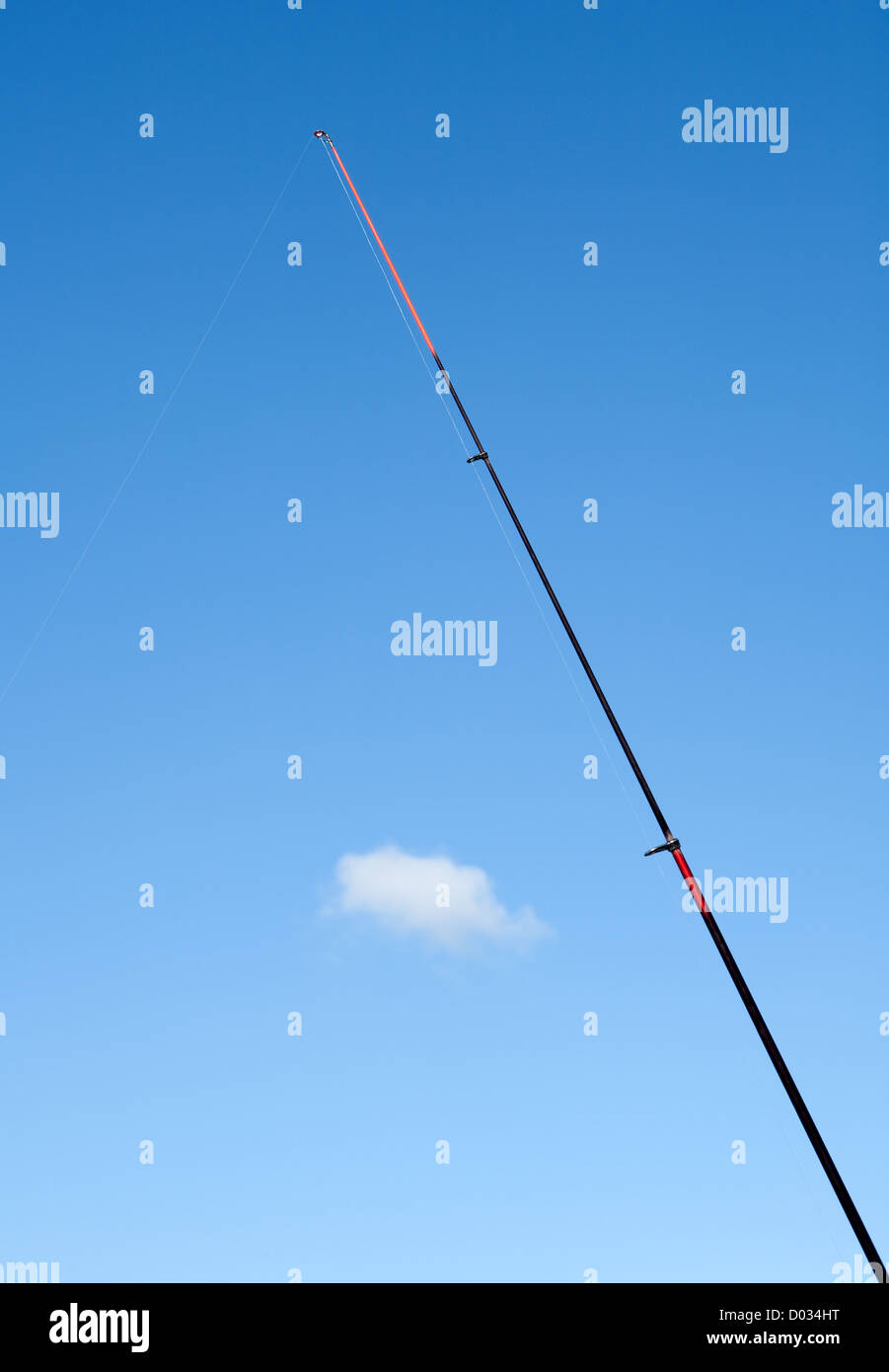 Fishing rod red against the blue sky Stock Photo - Alamy
