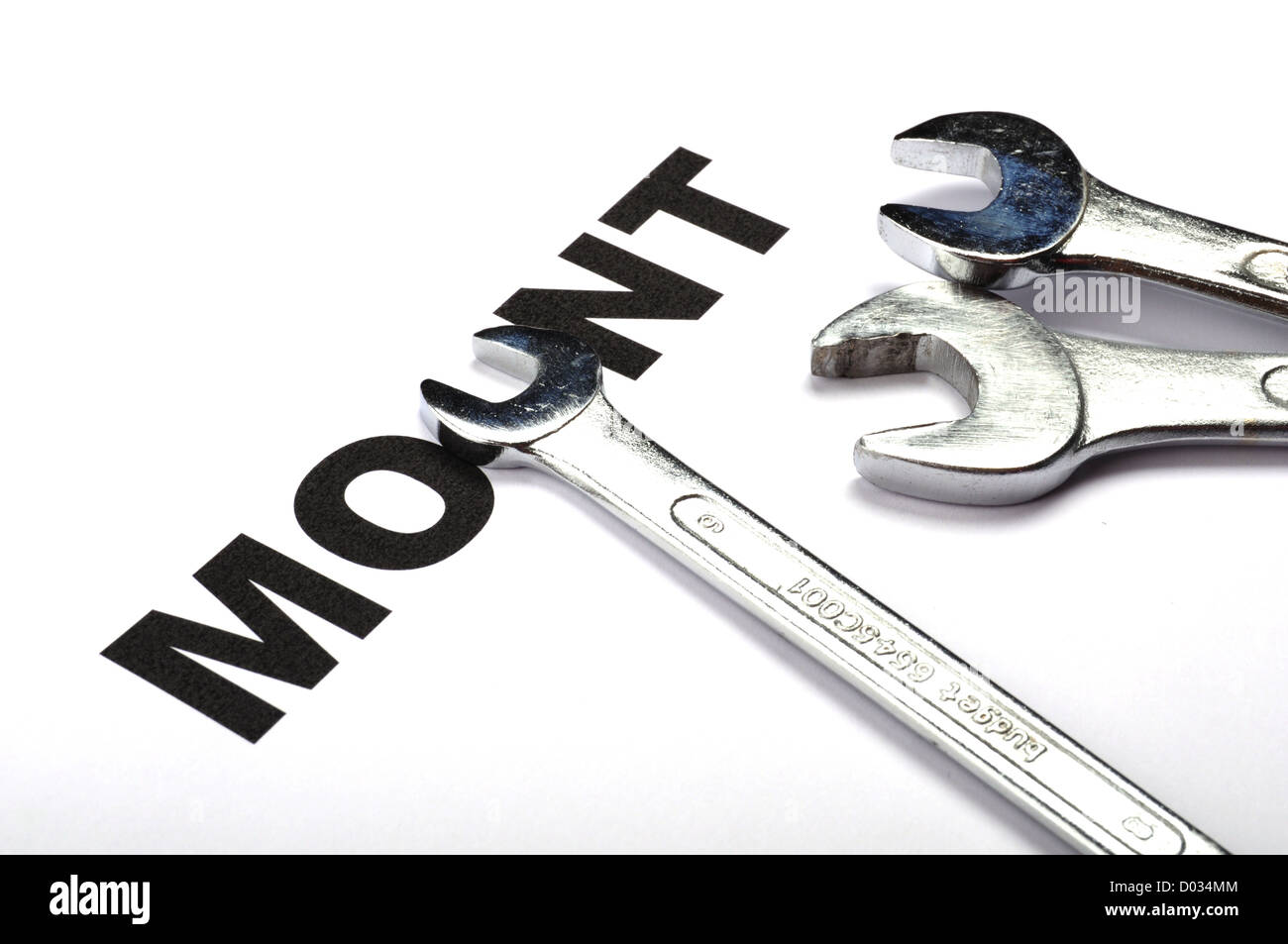 mount or mounting concept with tool and word Stock Photo - Alamy