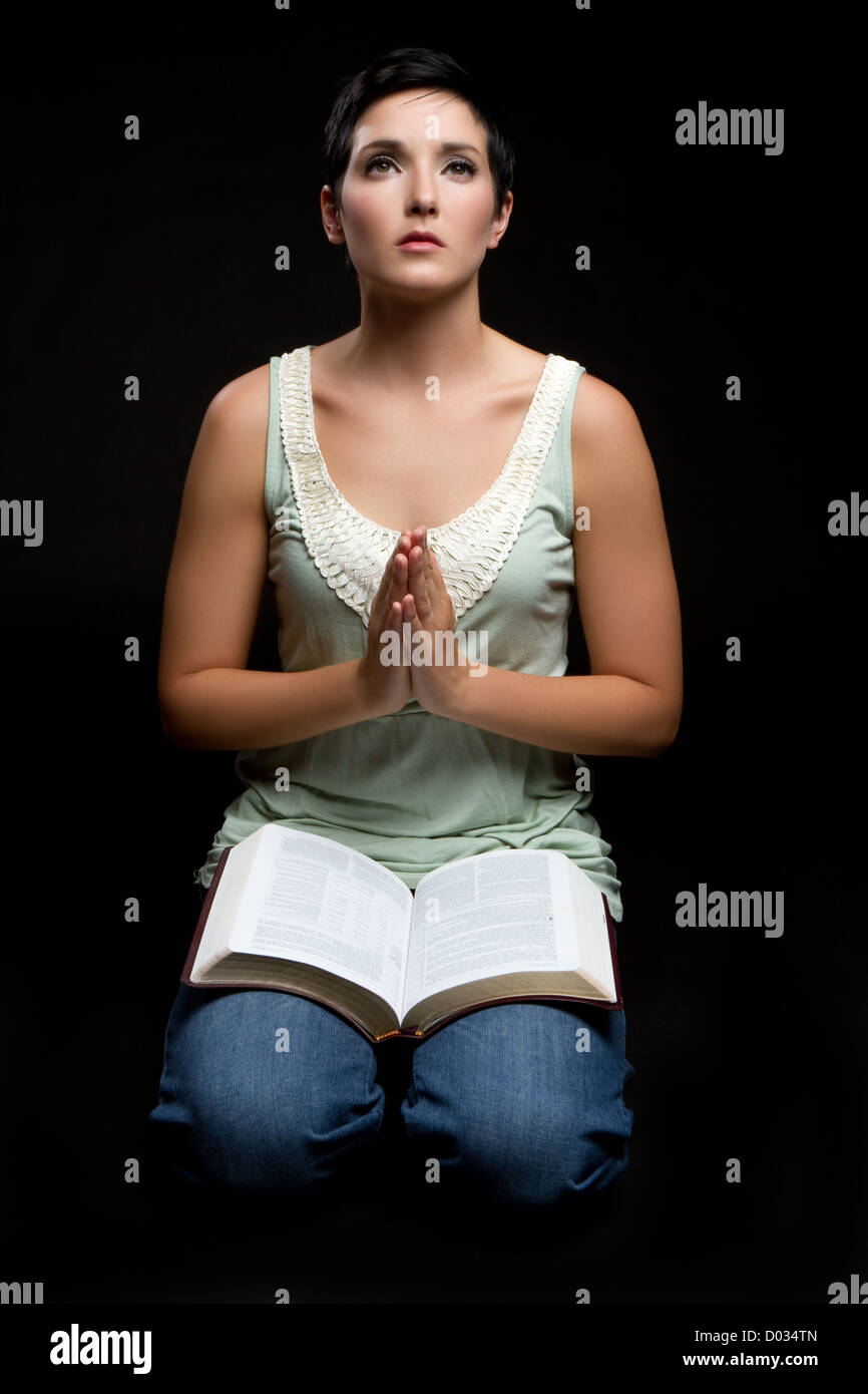 Religious christian bible praying woman Stock Photo - Alamy