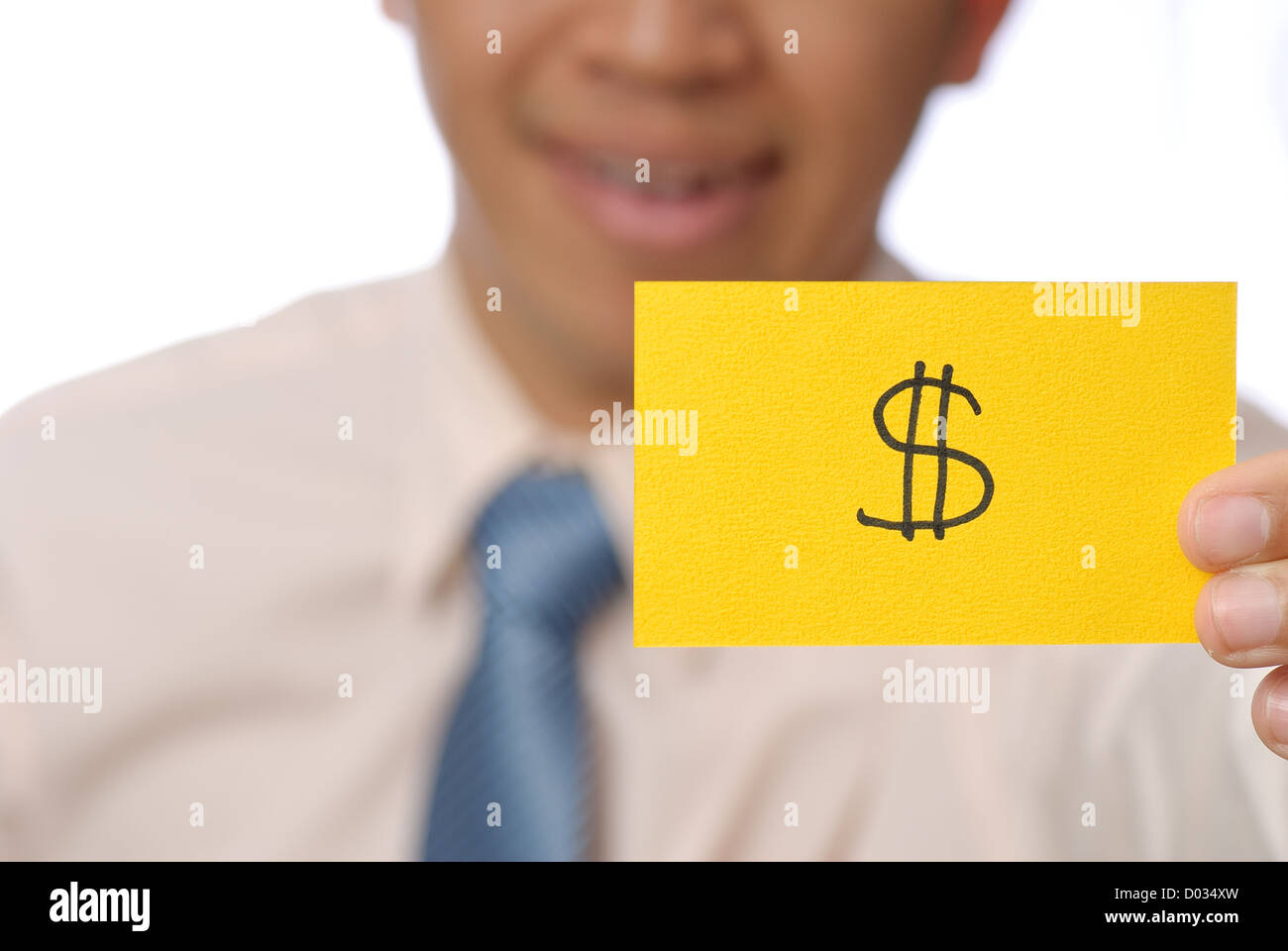 Money shape on yellow card holding by business man, closeup image Stock ...
