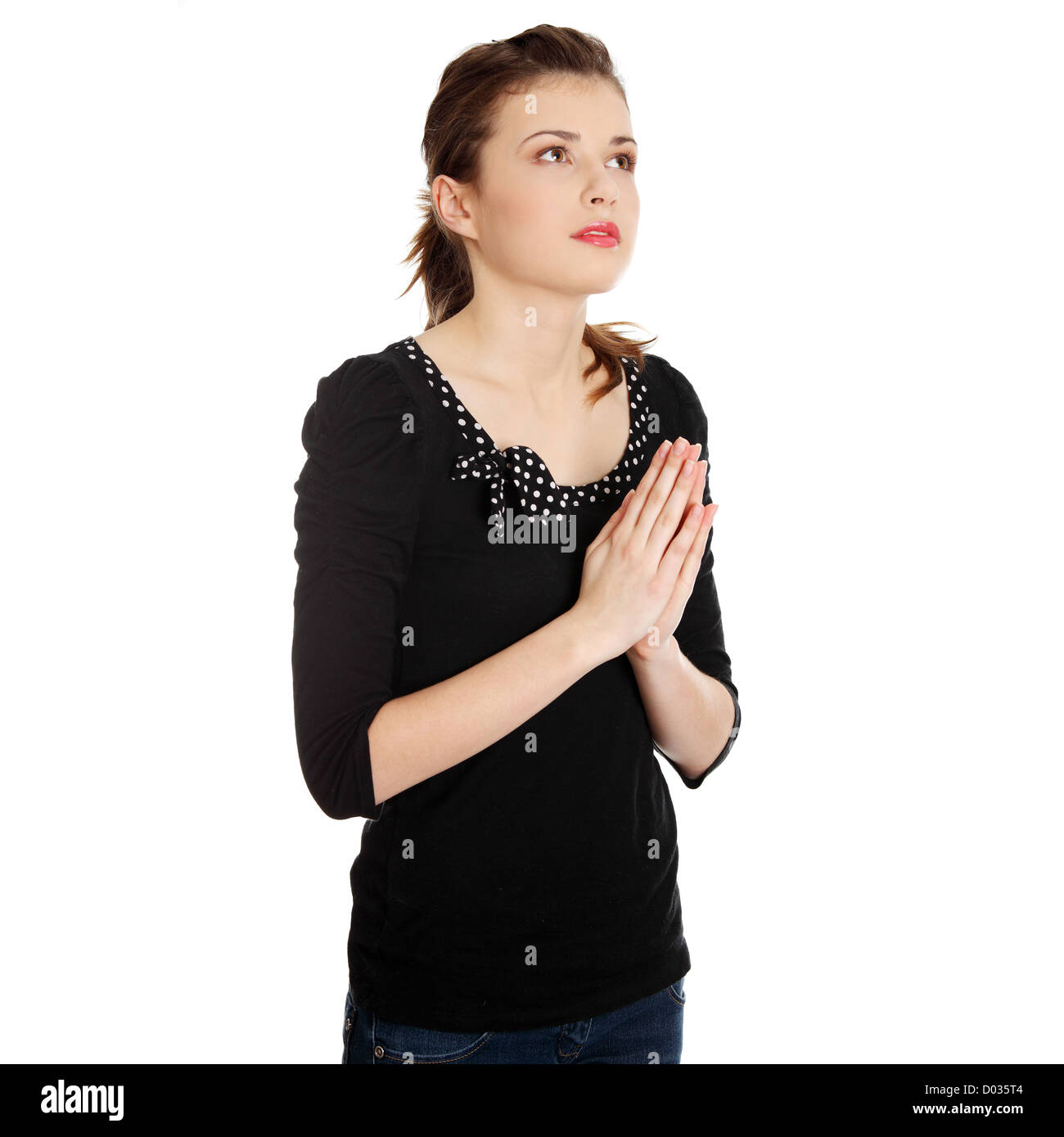 Closeup portrait of a young caucasian woman praying Stock Photo - Alamy