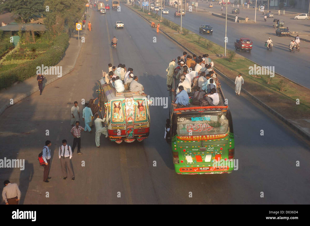 Passengers travel on an overload bus due to non-availability of ...