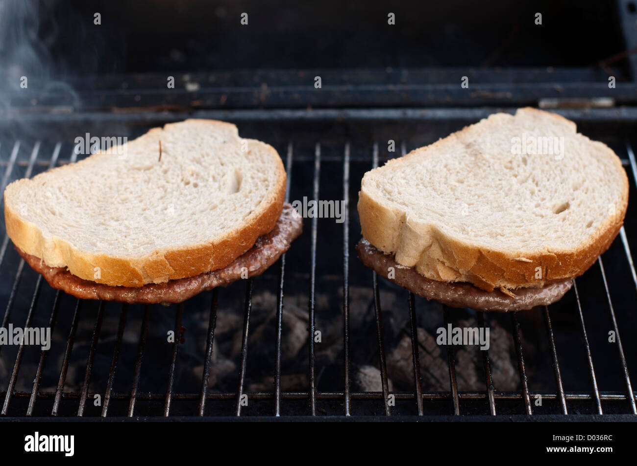 Meat and bread on barbecue grill hi-res stock photography and images ...
