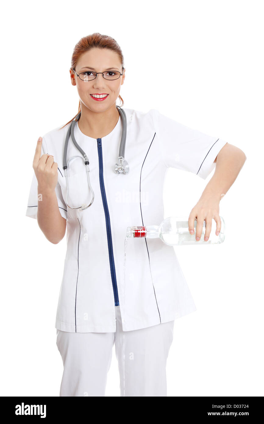 Female doctor pouring vodka bottle Stock Photo - Alamy
