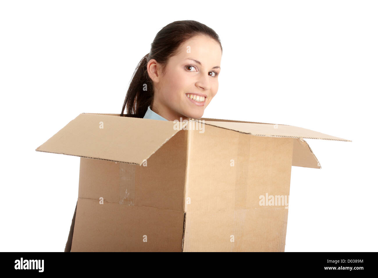 Thinking inside a box. Young business woman in cardboard box, isolated ...