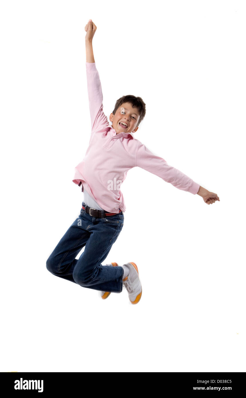 Adorable child jumping a over white background Stock Photo - Alamy