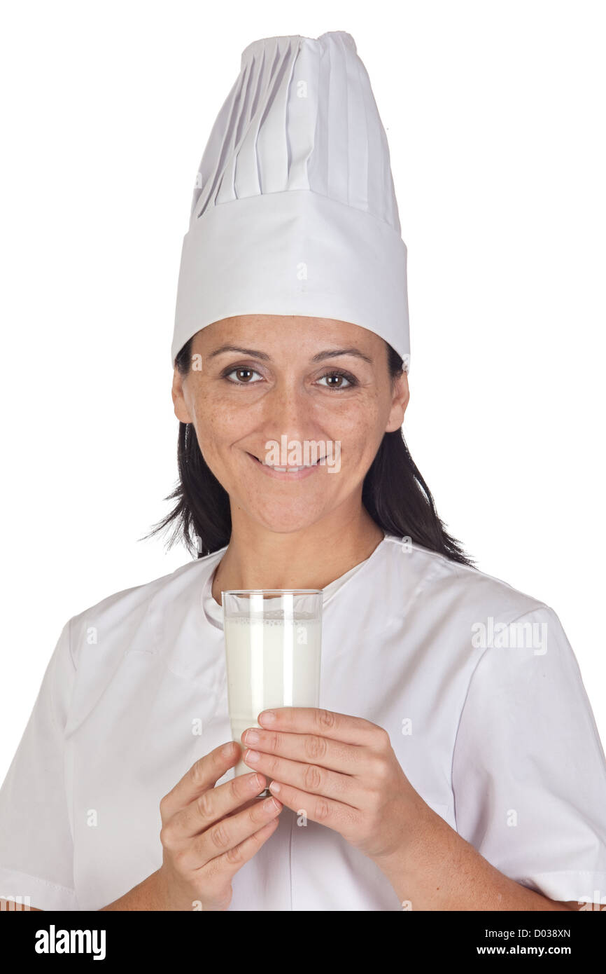 Pretty cook girl with a glass of milk isolated on white background ...