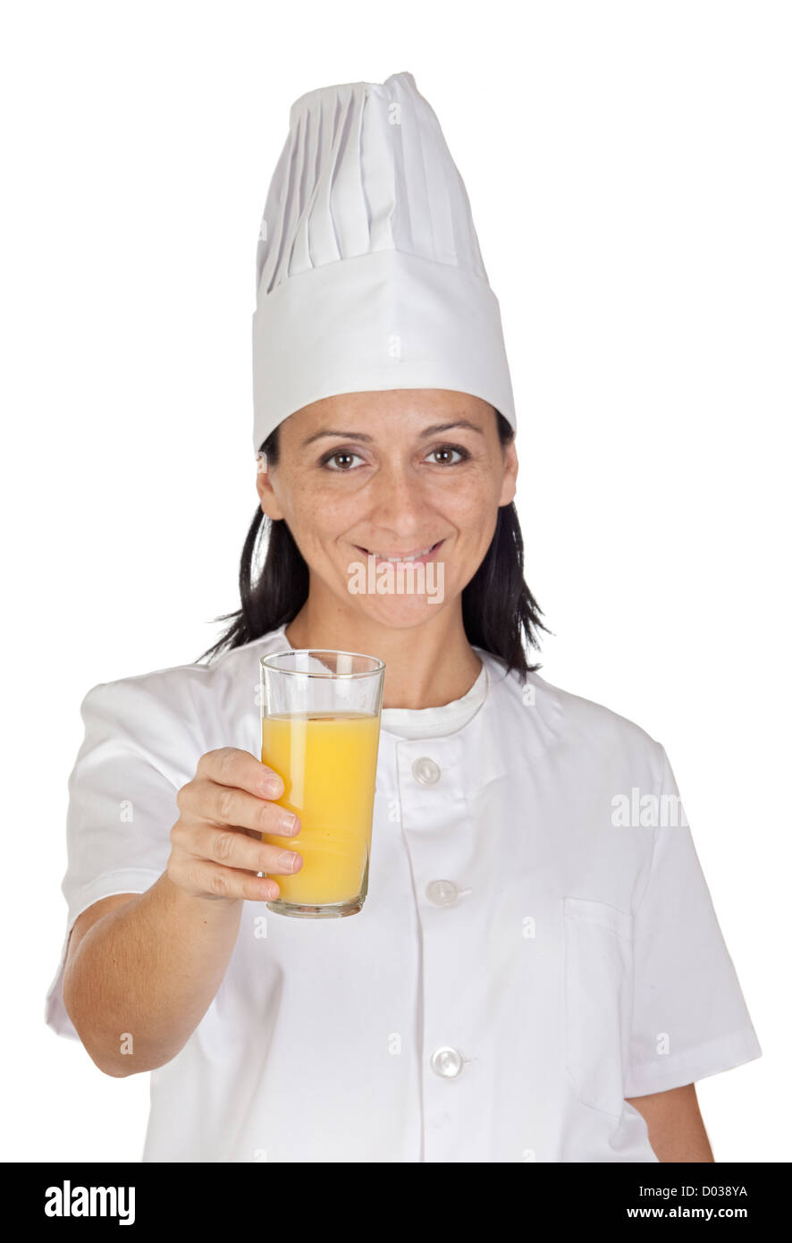 Pretty cook girl with a glass of orange juice isolated on white ...