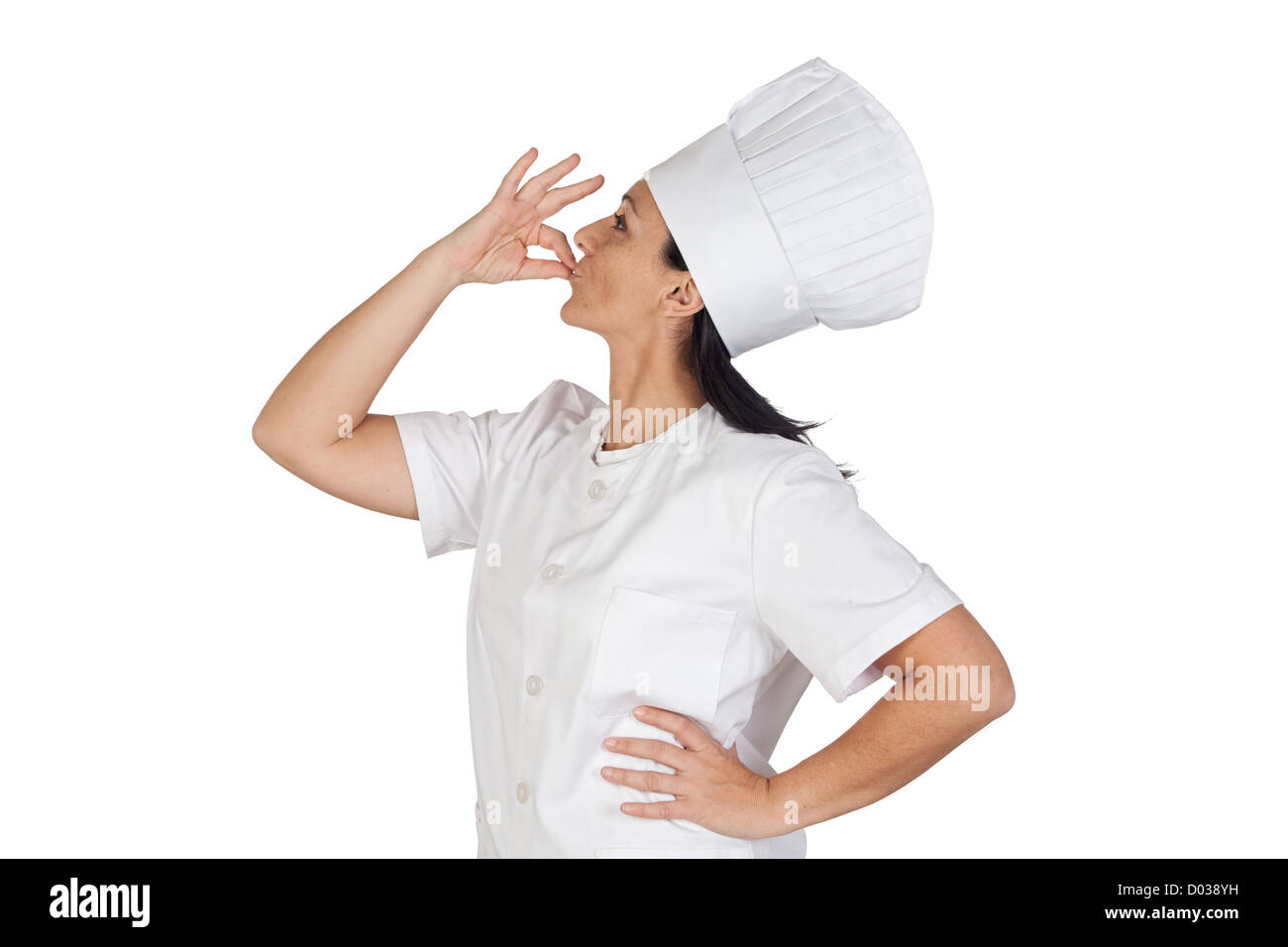 Pretty cook girl with uniform saying delicious isolated on white ...