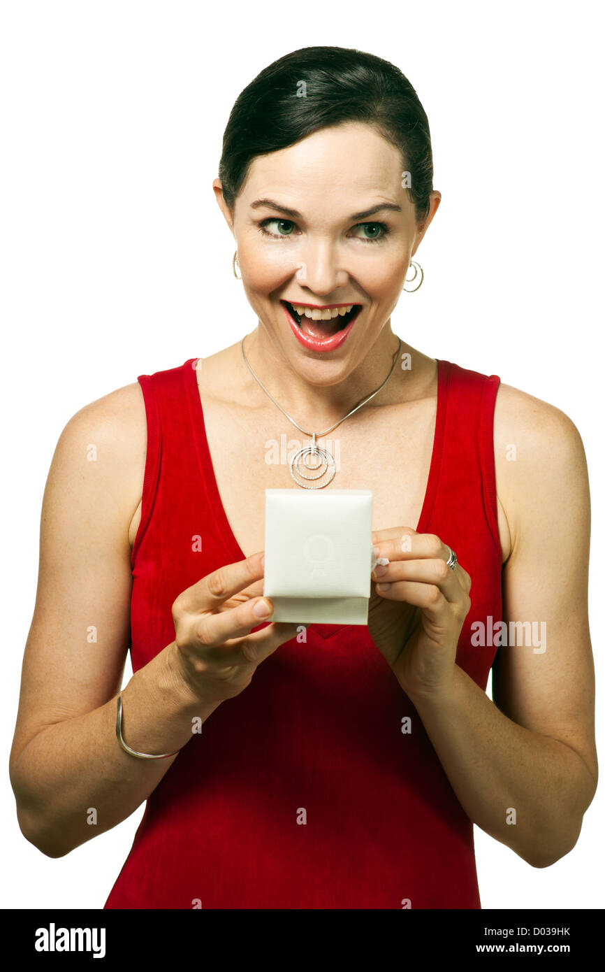 Very attractive young woman opening jewellery gift box. Smiling and ...