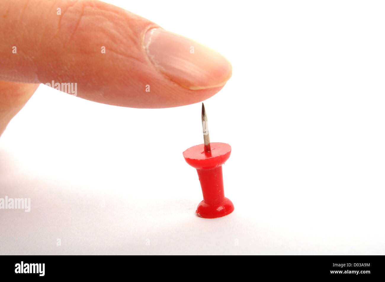 risk concept with finger over risky pin Stock Photo - Alamy