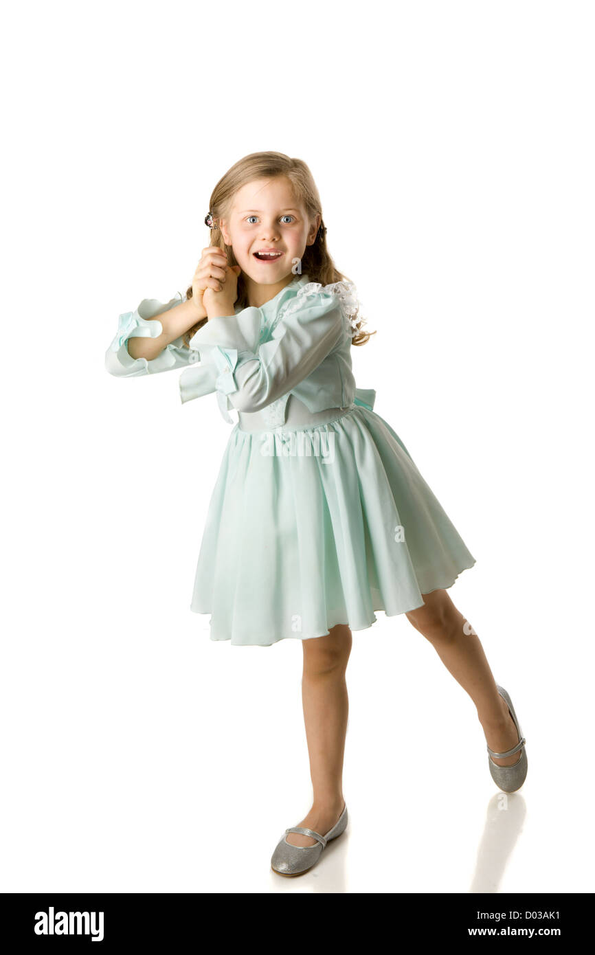 Cheerful girl spinning on floor isolated on white Stock Photo - Alamy