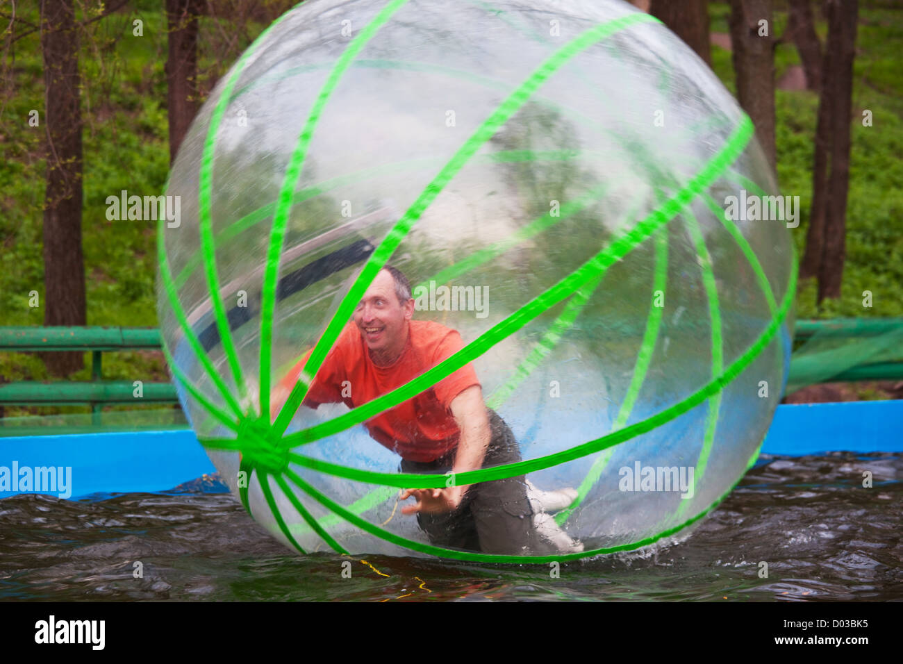 Man inside zorbing ball hi-res stock photography and images - Alamy