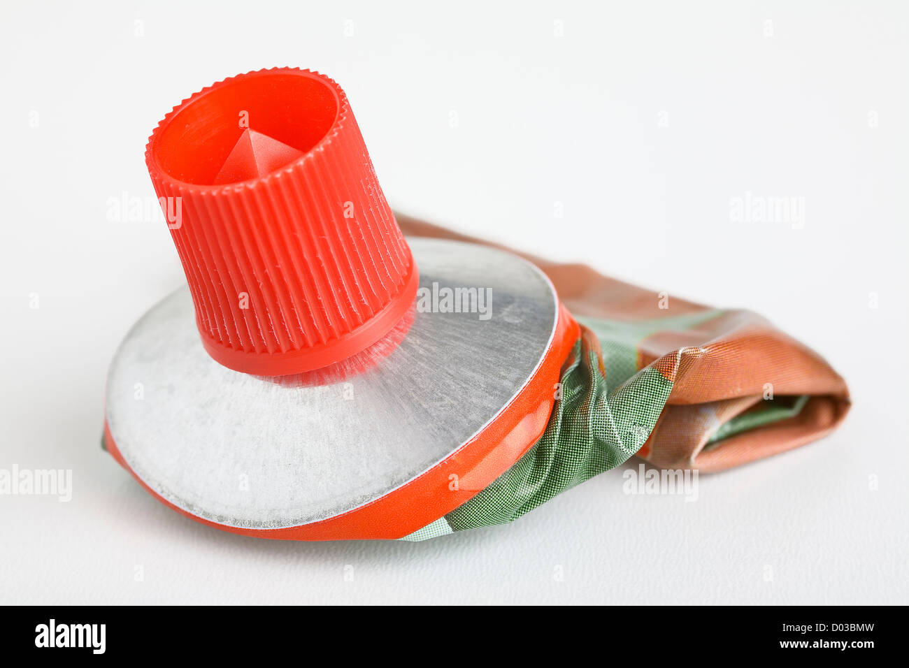 Close up of old empty metal tube(tomatoe paste), isolated on white ...