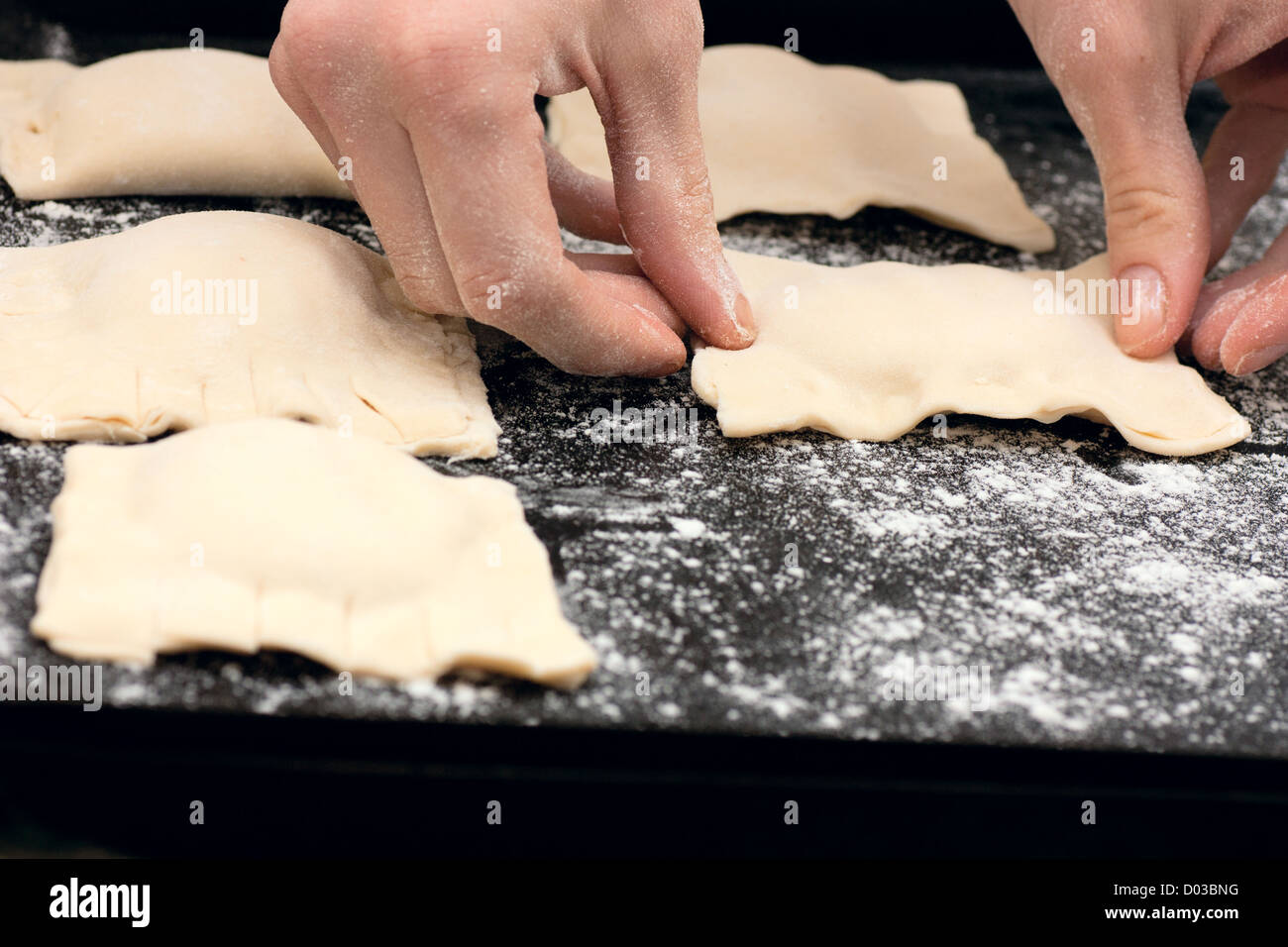 Baking hand hi-res stock photography and images - Alamy