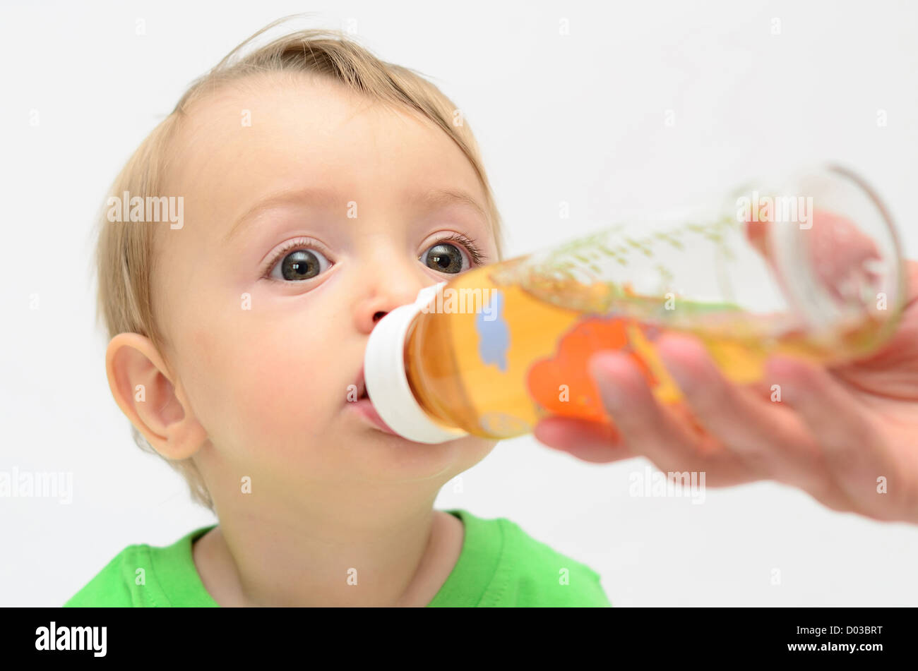 a little boy fed by his mother Stock Photo - Alamy
