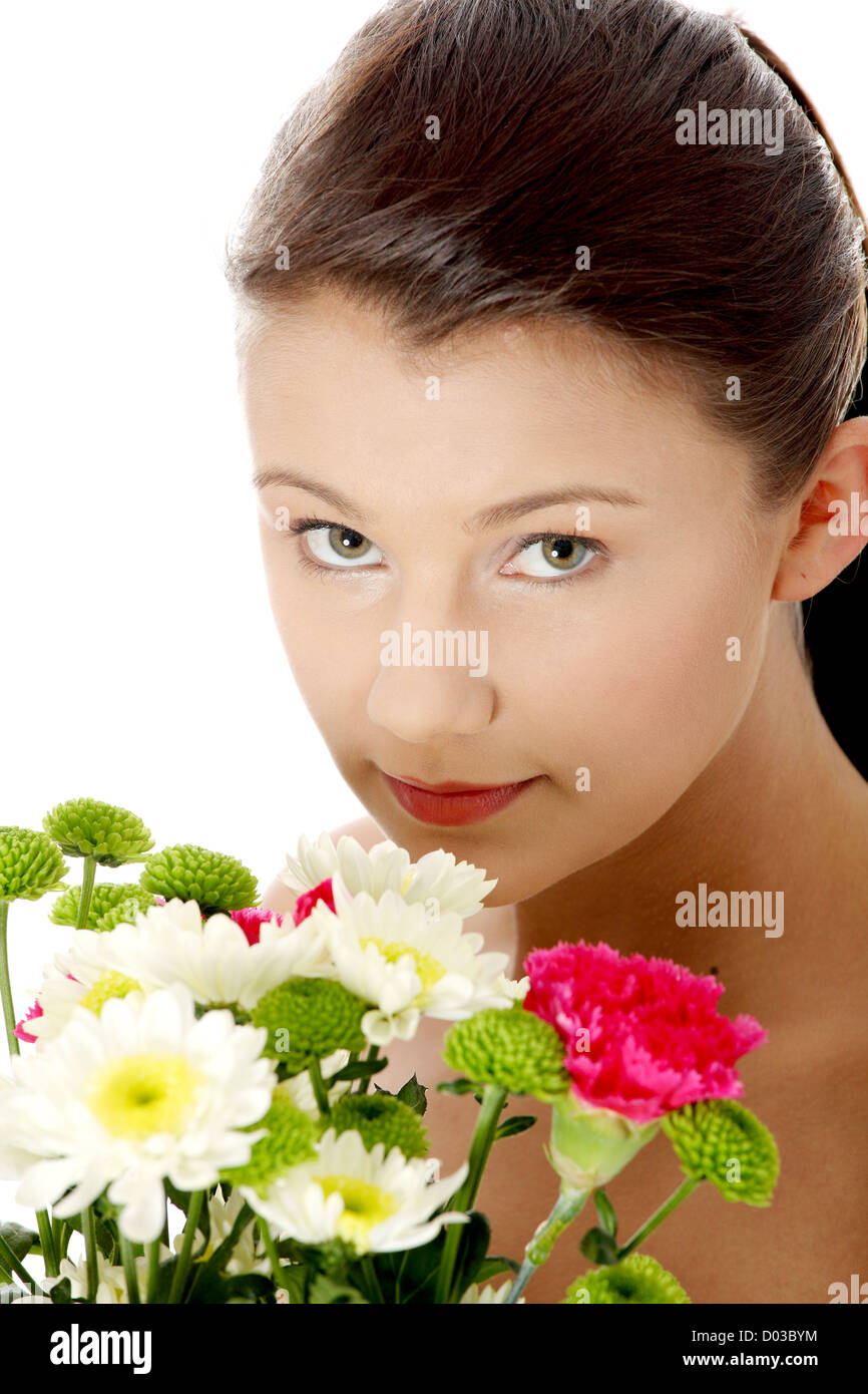 Beautiful woman holding fresh spring flowers Stock Photo - Alamy