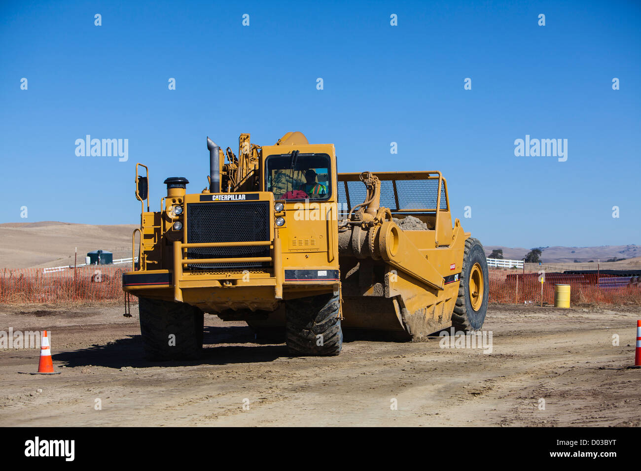 Heavy equipment machines work to build a new road Stock Photo - Alamy