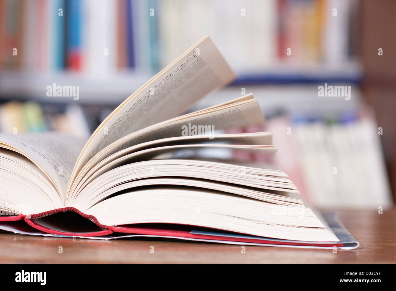 Open book with library in background.Use for education concept Stock ...