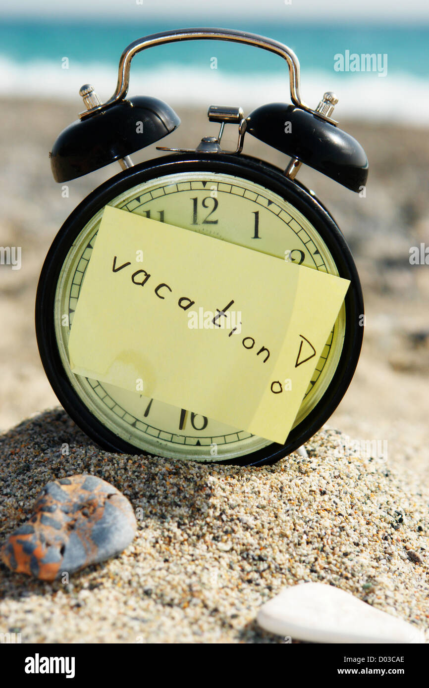 a closeup of an old clock on a beach Stock Photo - Alamy