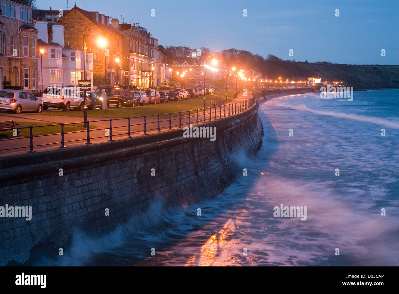 Filey Bay and seafront looking up the promenade as day turns to night ...