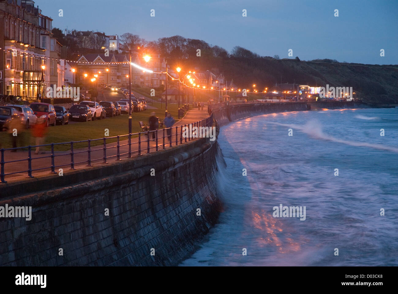 Filey Bay and seafront looking up the promenade as day turns to night ...