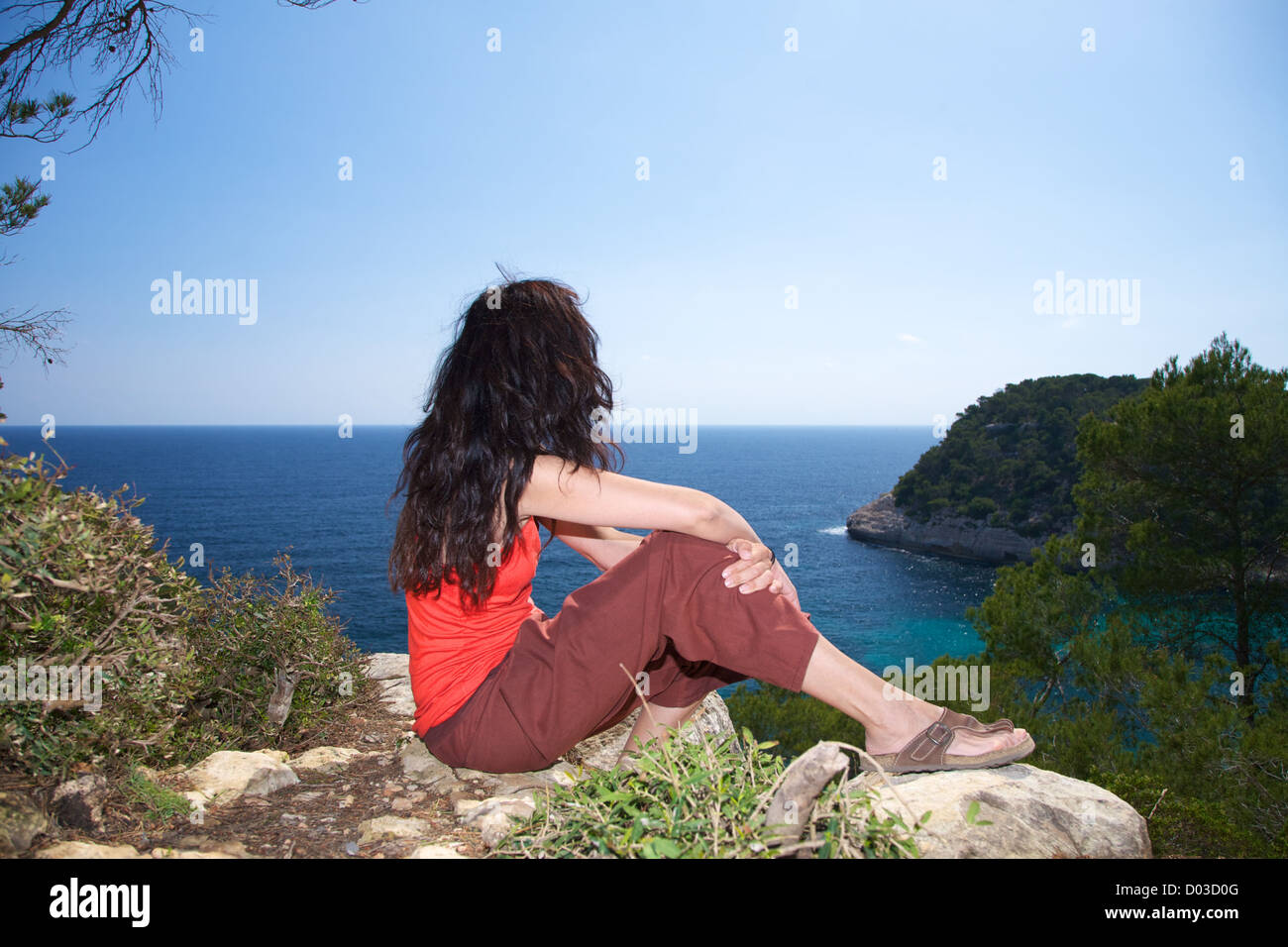 Woman on top at Menorca island in Spain Stock Photo - Alamy