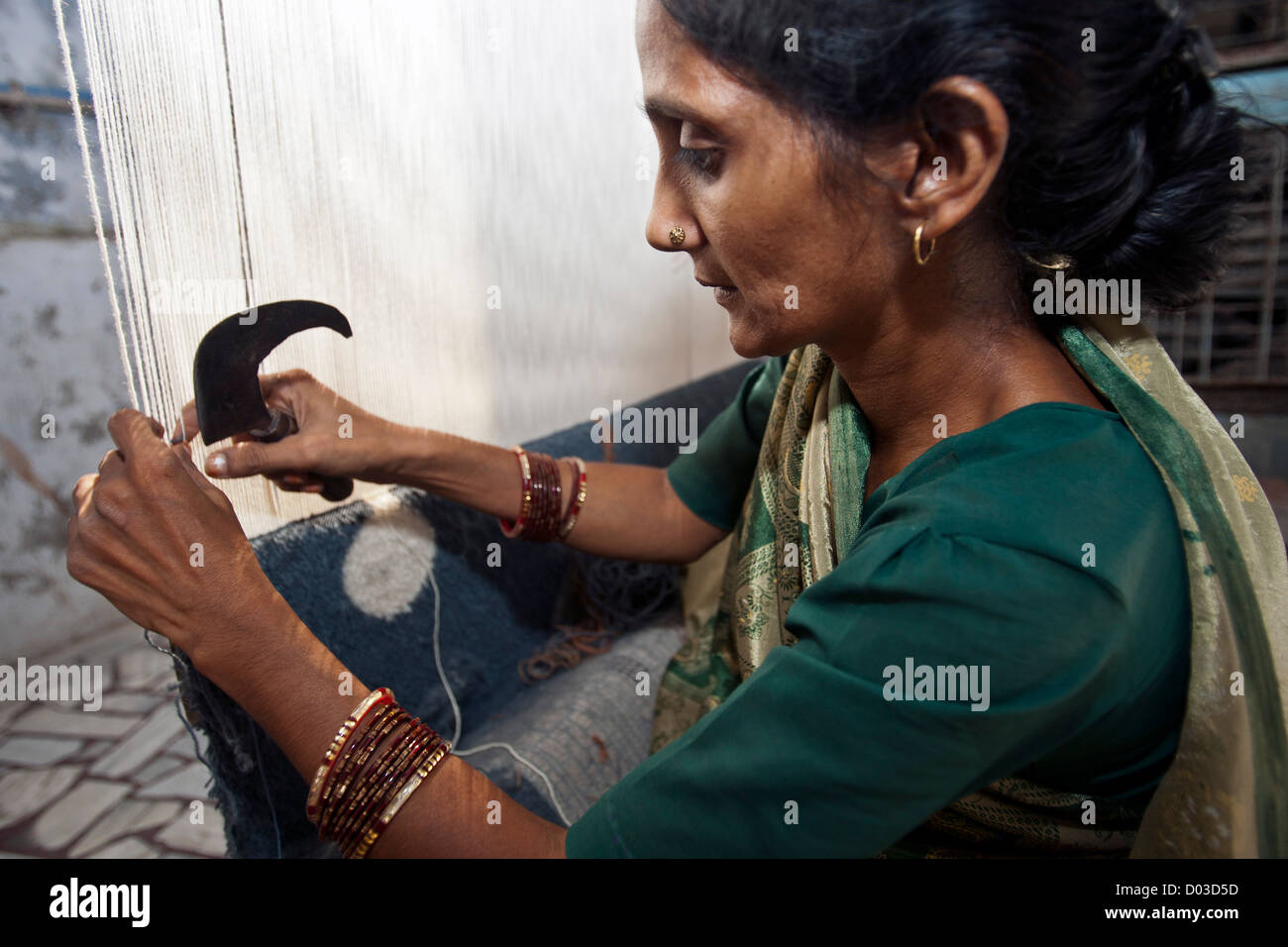 Woman at carpet loom India Stock Photo - Alamy