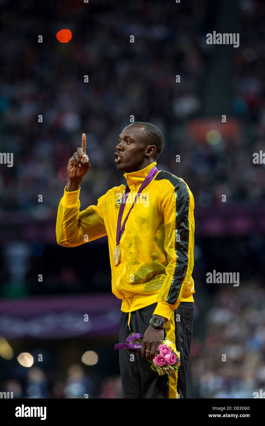 Usain bolt winning gold medal at london olympics hi-res stock ...