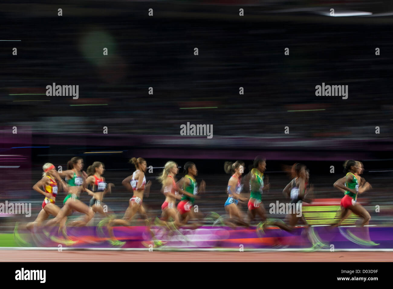 Blurred action of women competing in the Women's 3000m Steeplechase at the Olympic Summer Games ...