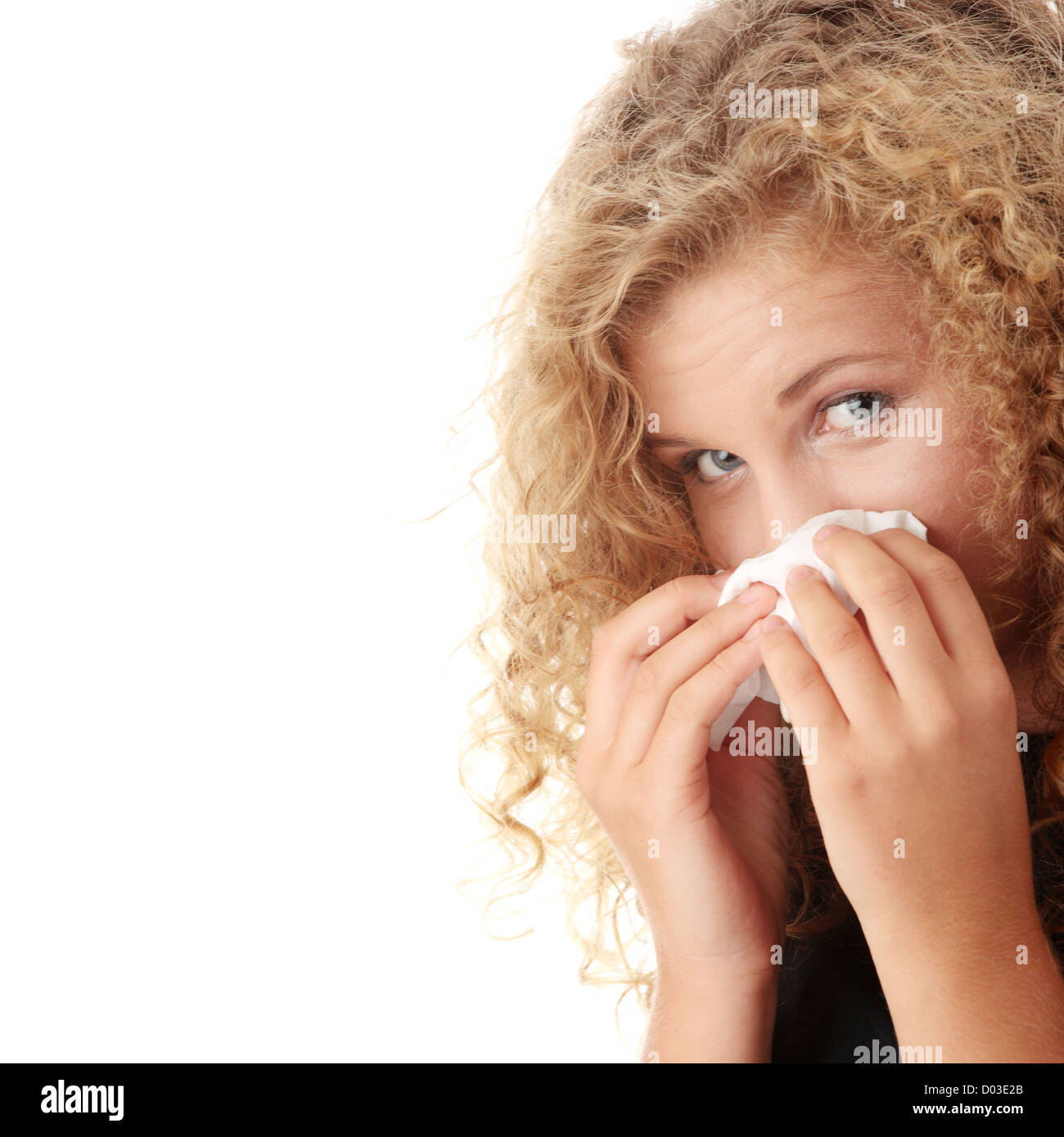 Young blonde woman having a cold close up isolated on white background ...