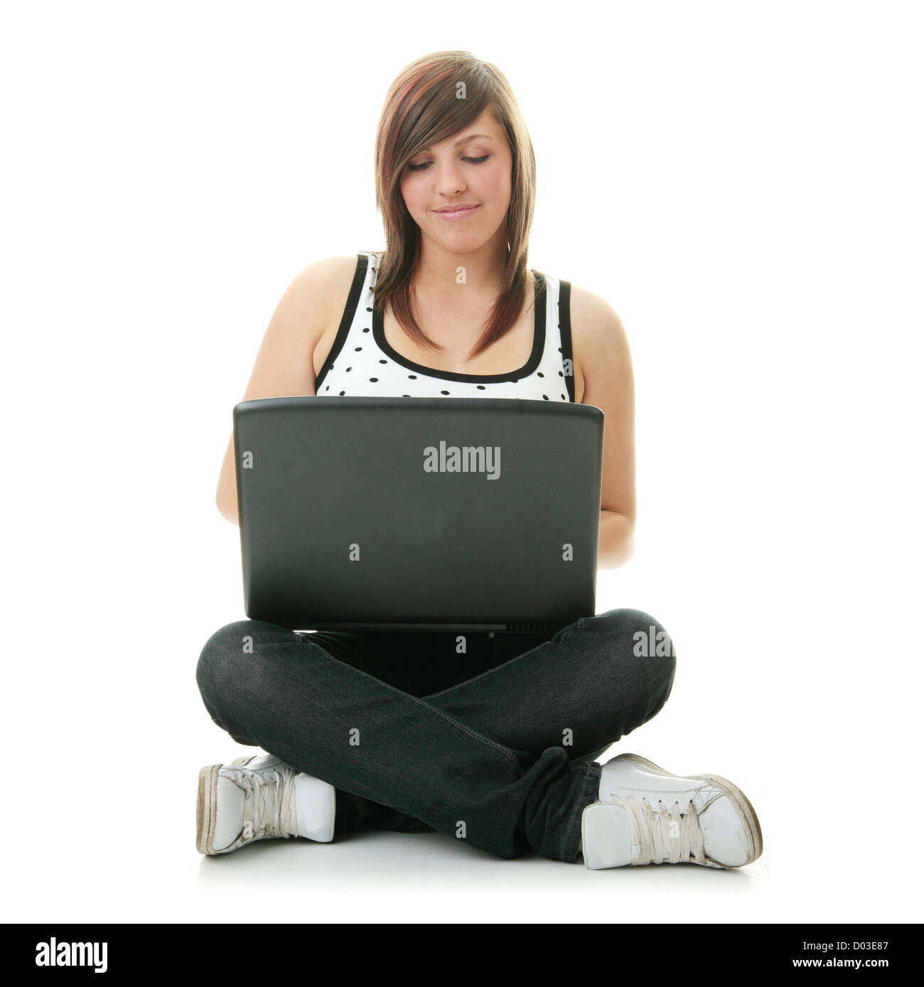 Girl working on her laptop, sending an e-mail or learning Stock Photo ...
