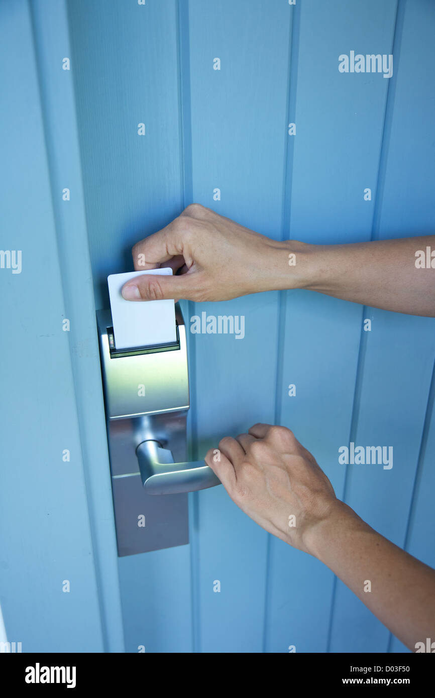 metal lock-card and handle on blue wood door Stock Photo - Alamy