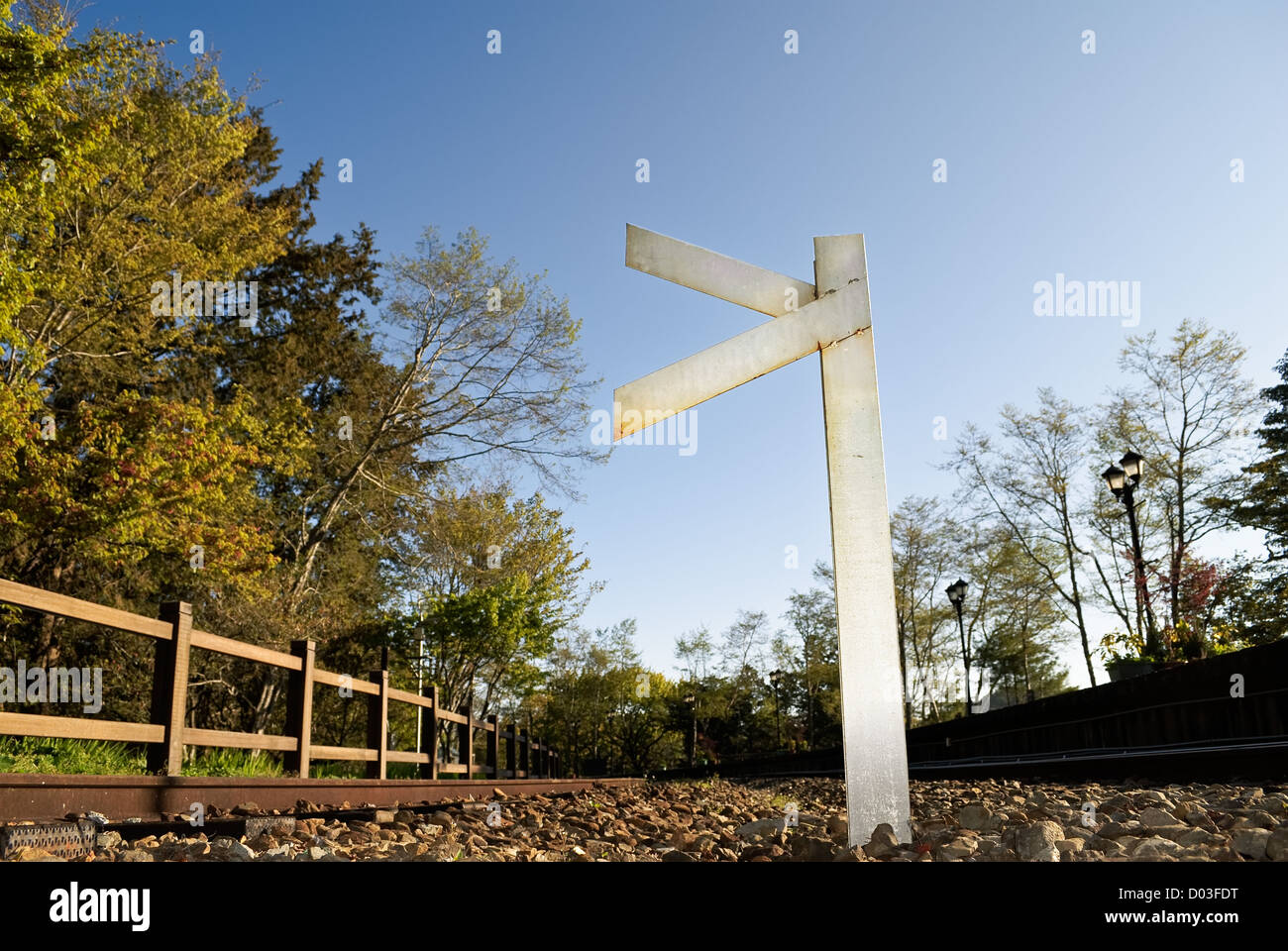 Blank sign on railway under blue sky in forest Stock Photo - Alamy