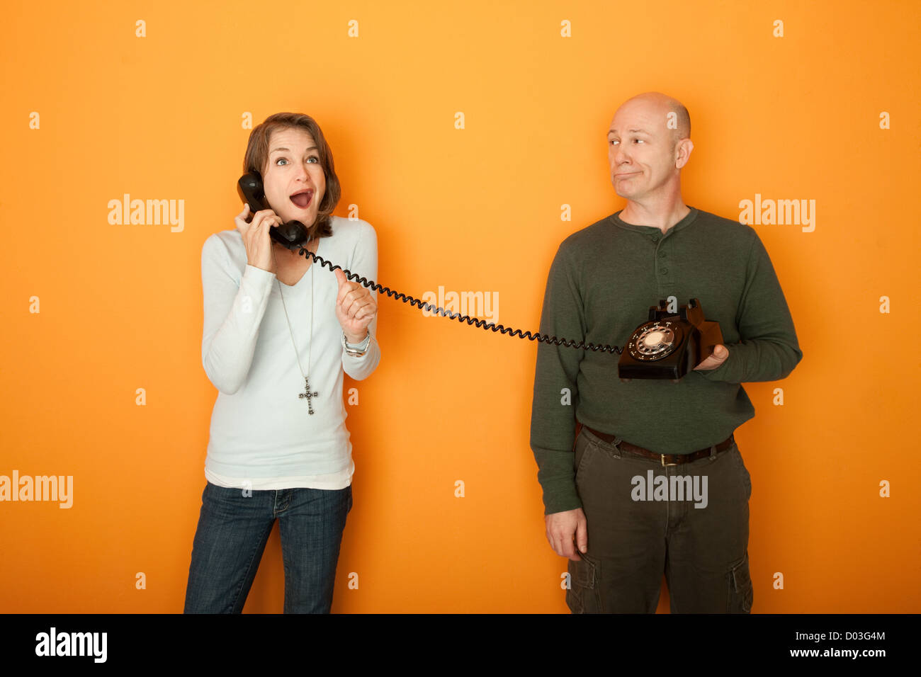 Excited Caucasian woman on telephone call with a middle-aged man on ...