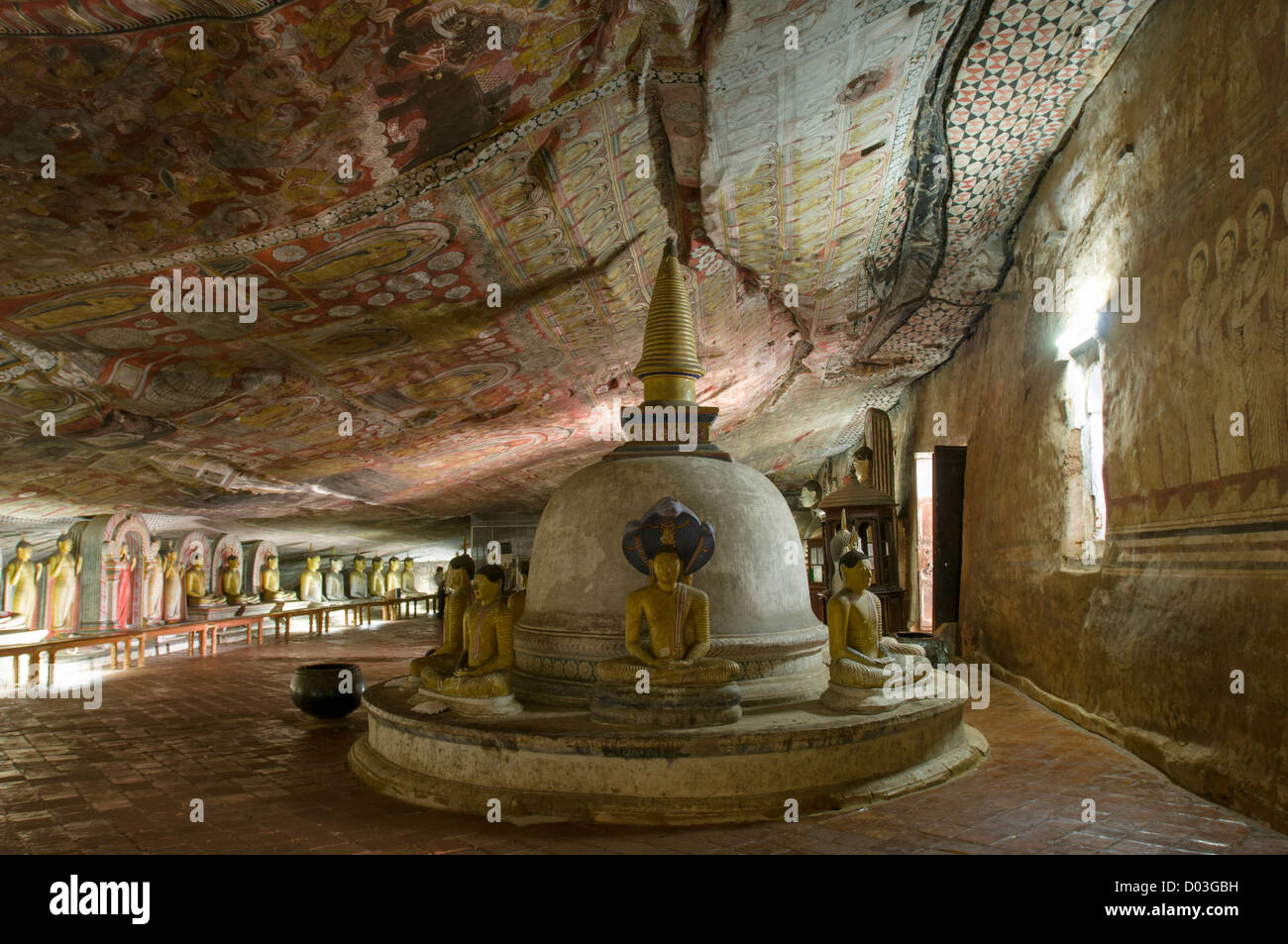 Stupa surrounded by Buddha images inside the Dambulla Cave Temple, Dambulla, Sri Lanka Stock ...