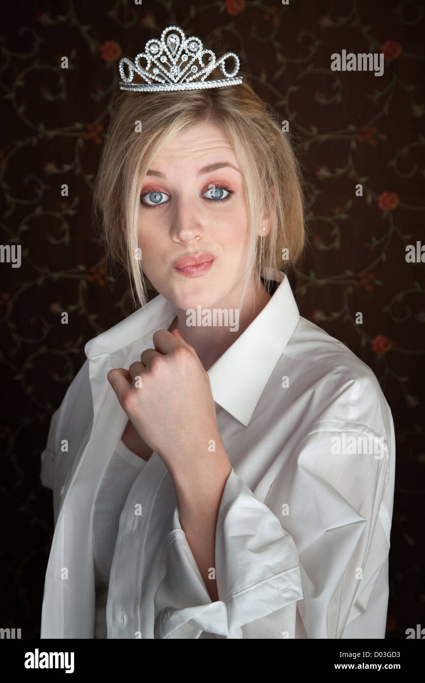 Beautiful Caucasian woman wearing loose shirt and crown Stock Photo - Alamy